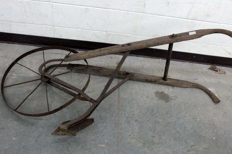 Antique single wheel hand field plow cultivator - Bunting Online Auctions