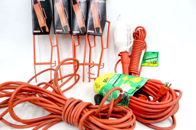 Two Electrical cords two cord storage holders and a 110v drop light ...