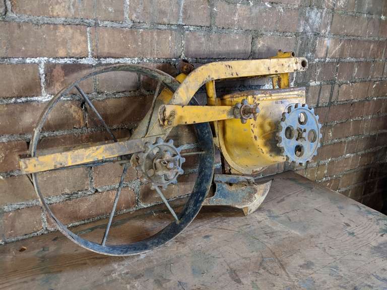 vintage yellow rototiller planter - Bid On Estates Auction Services