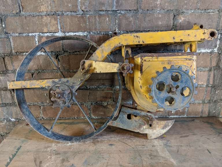 vintage yellow rototiller planter - Bid On Estates Auction Services