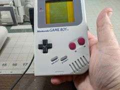 NINTENDO GAMEBOY, HANDY BOY, AND POWER PACK (GAMEBOY POWERED ON AND ...
