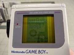 NINTENDO GAMEBOY, HANDY BOY, AND POWER PACK (GAMEBOY POWERED ON AND ...