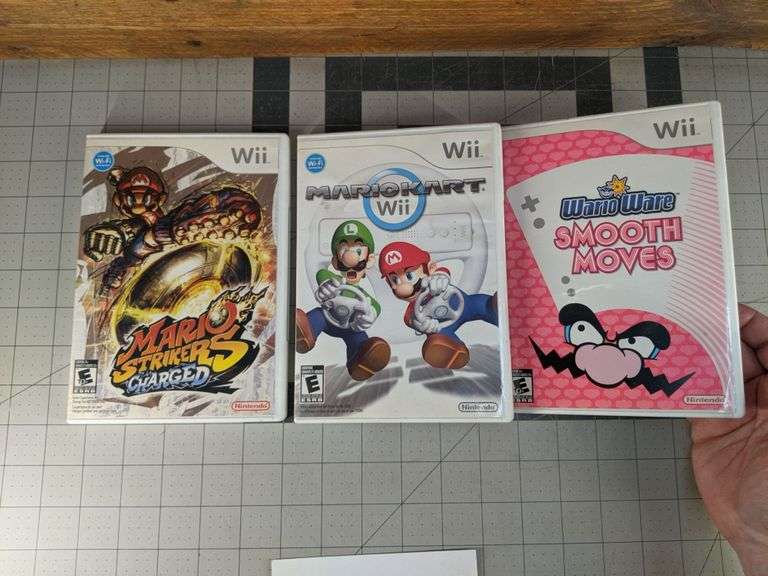 Wii: 3 Games. Mario Strikers Charged, MarioKart, WarioWare Smooth Moves ...