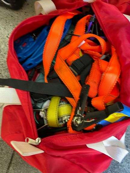 Back garage. Bag of bungee cords and tiedown straps and extension cords ...