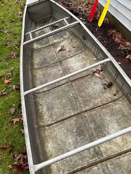 Approx 14’ Metal Canoe with Two Misc Ore’s . Inspect at Preview. NO ...