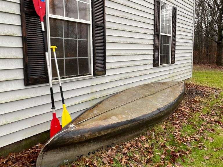 Approx 14’ Metal Canoe with Two Misc Ore’s . Inspect at Preview. NO ...