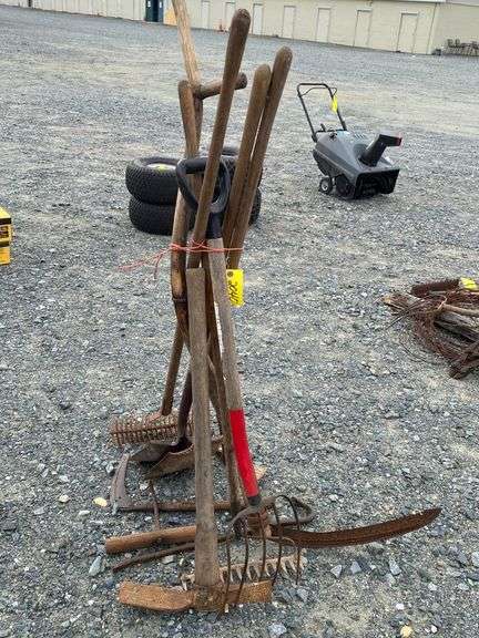 Lot of primitive outdoor tools, shovels, rakes, pickax, sling blade etc ...
