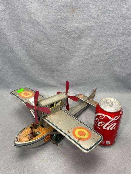 Tin airplane wind up toy - Dixon's Auction at Crumpton