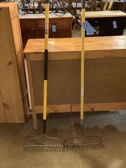 2 yellow handled Rakes one money - Diamond G Auctioneers