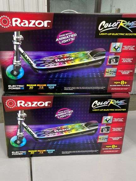 (2) RAZOR LIGHT UP ELECTRIC SCOOTERS IN BOXES - Earl's Auction Company