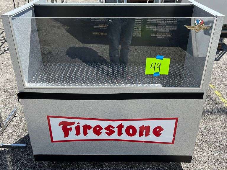 IMS FIRESTONE DISPLAY CASE/STAND - Earl's Auction Company