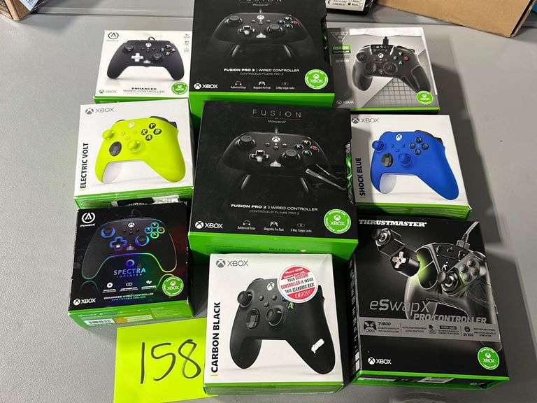 (9) ASSORTED XBOX CONTROLLERS IN BOXES - Earl's Auction Company