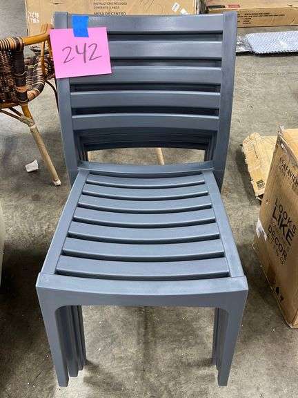 (4) GREY PLASTIC STACKING CHAIRS - Earl's Auction Company