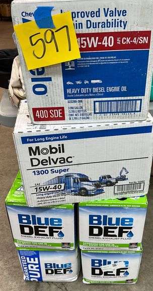 (4) BOXES OF BLUE DEF & (2) BOXES OF ENGINE OIL - Earl's Auction Company