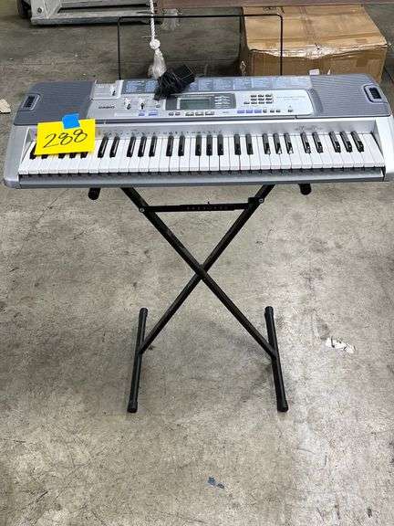 CASIO LK-100 KEYBOARD W/ STAND - Earl's Auction Company