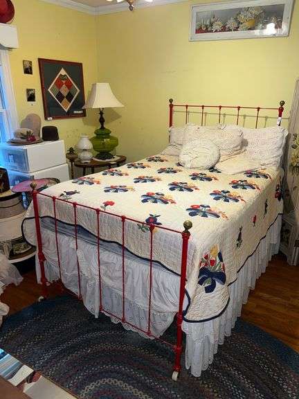 Red metal bed w/bed coverings - Auction Services LTD