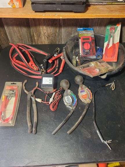 Jumper cables, oil drain pan, spark plug pliers, multimeter, coolant ...