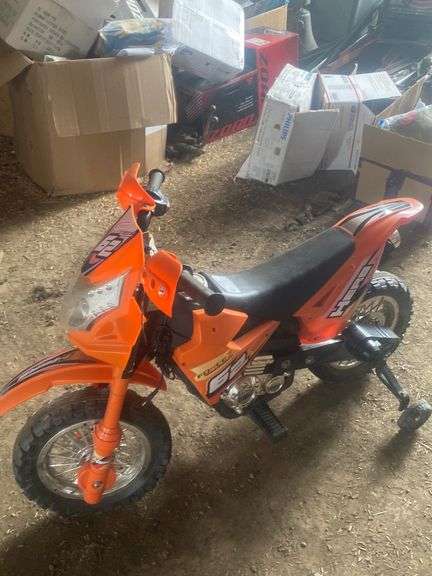 Orange mini bike - Gregg Auctions