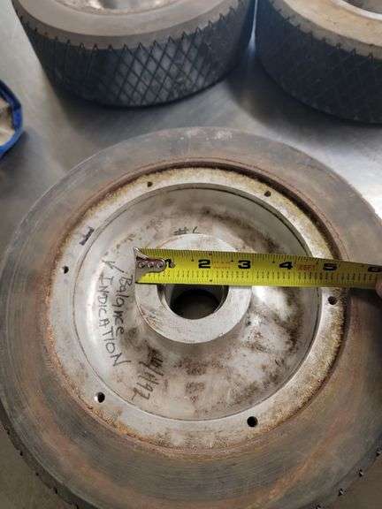 11" vulcanized rubber wheels 1.5" bore - Gregg Auctions