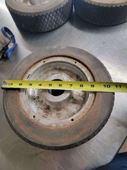 11" vulcanized rubber wheels 1.5" bore - Gregg Auctions