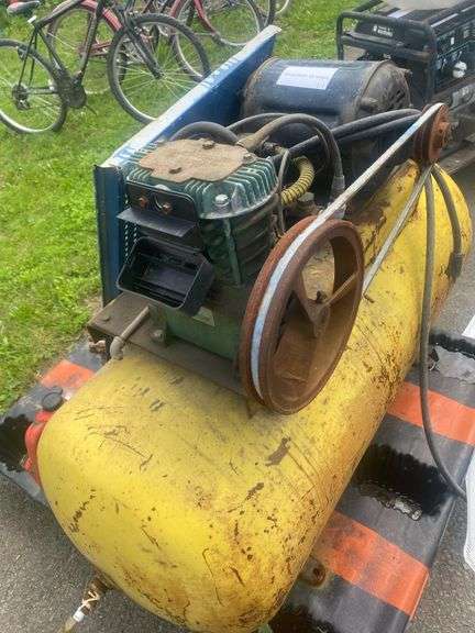 Yellow air compressor - Gregg Auctions