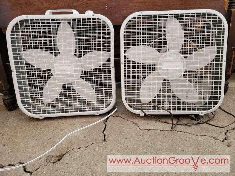 Two box fans. The Lasko has some broken pieces, the Holmes appears to ...