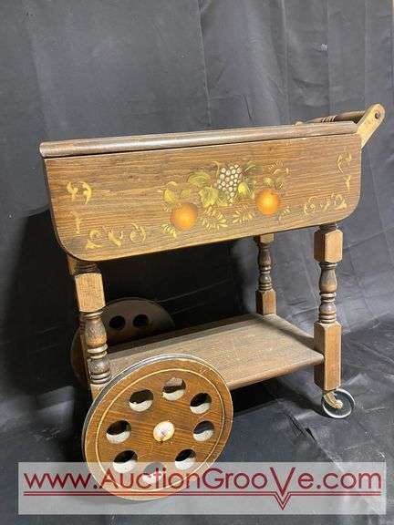 Functional and decorative at the same time, this rolling wooden cart ...