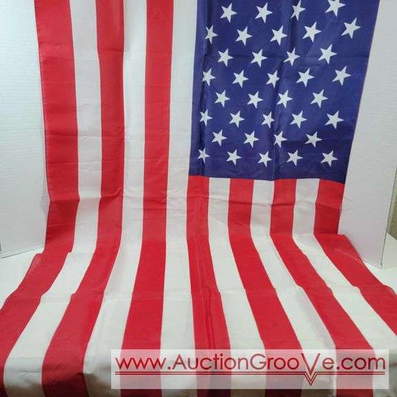 American Flag. Nylon. Comes with plastic eagle flag topper. 34 x 60. DR ...