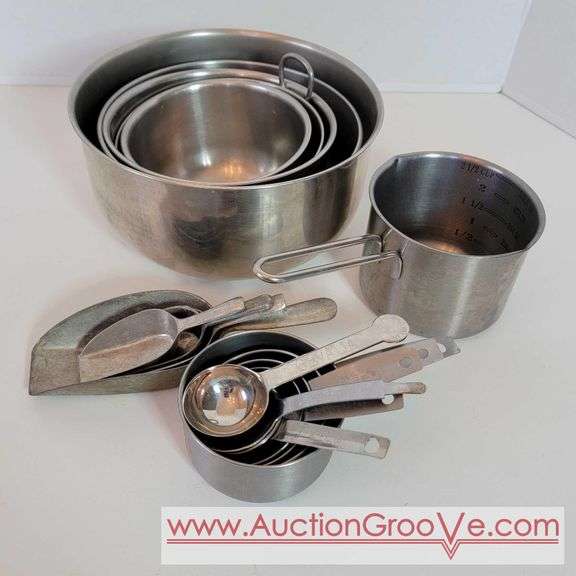 5 stainless steel nesting bowls and measuring cups. Largest bowl is 8.5 ...