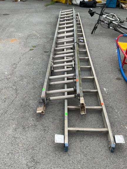 Ladders lot. One 16ft aluminum section, plus a 28ft Fiberglass ...