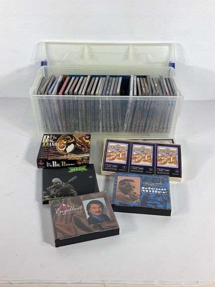 Poly CD case, full of CDs, plus box of cassettes - Hash Auctions