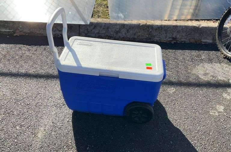 Coleman wheeled Cooler, blue color - Hash Auctions