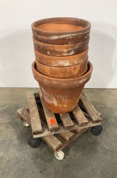 Two rolling planter stands and 6 terracotta pots - Hash Auctions