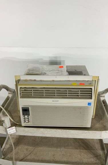 Sharp window unit air conditioner with 2 remotes. 18.5x17x14” works ...