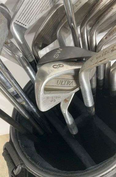 Pro select golf bag with a few Titleist iron some Wilson Irons and ...