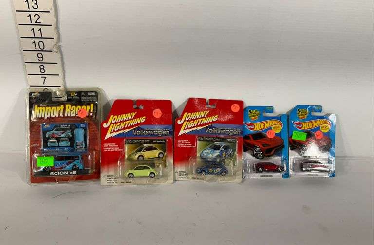Five die-cast metal cars, unopened, includes two Hotwheels, two Johnny ...