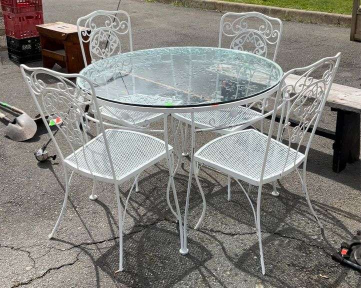 Five pc Wrought Iron Outdoor Table Set, four chairs and the 42” round ...