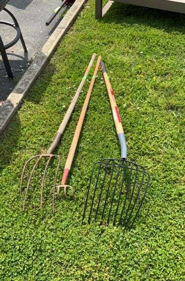 Tools, two pitch forks and one scratch rake, used and bent as shown ...