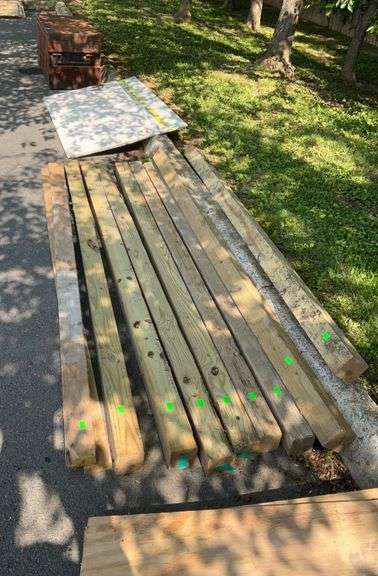 Eight 4x4”:posts, two 2x4 boards, posts are pressure treated, 8 foot ...