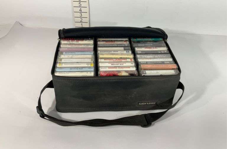 Case logic case full of cassette tapes, includes Barbra Streisand ...