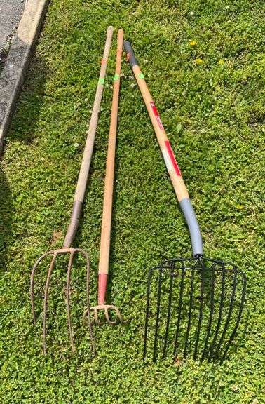 Tools, two pitch forks and one scratch rake, used and bent as shown ...