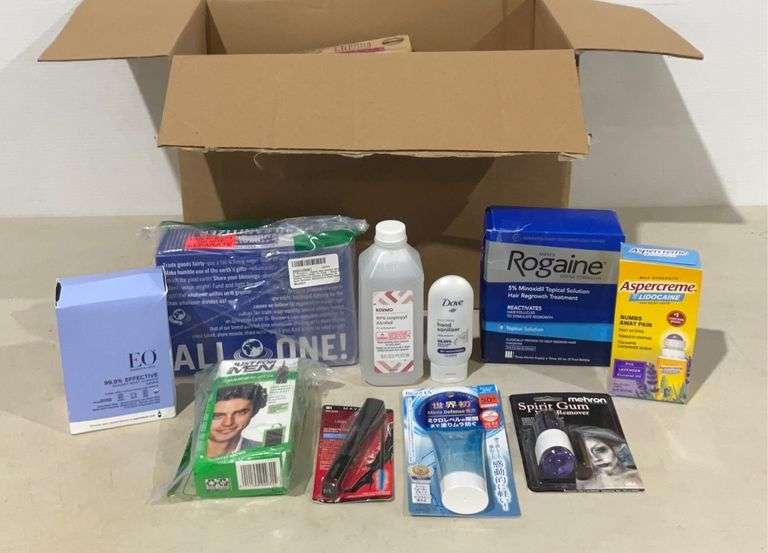 Box of new products, isopropyl alcohol, mascara, pain relief liquid ...