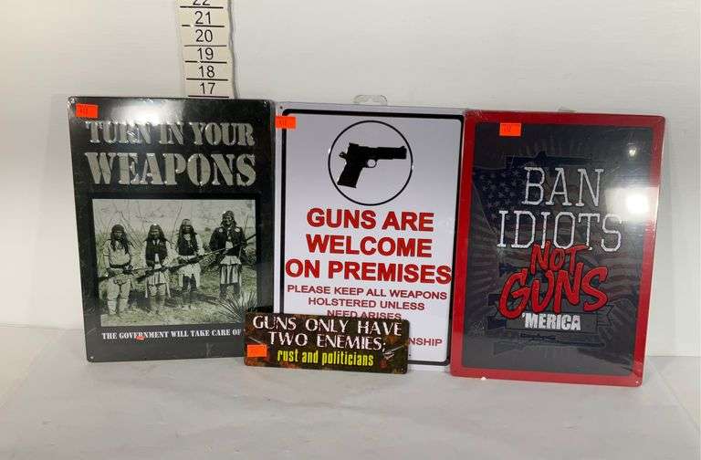 Four metal gun signs, includes turn in your weapons, rust and ...
