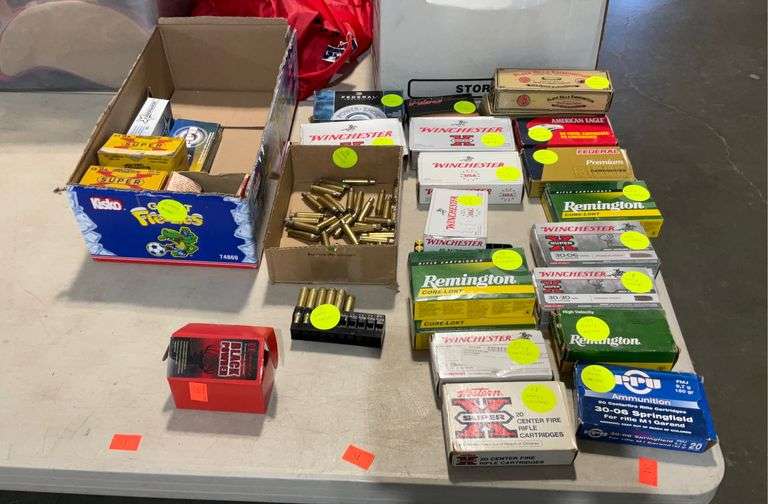 Large group of mixed empty shell casings, a few empty boxes, and a ...