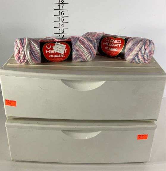 2 hard plastic Tenex drawer storage containers filled with pastel ...