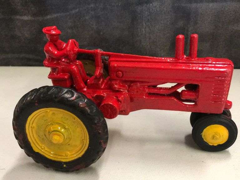Vintage red toy tractor - Integrity Auctioneers