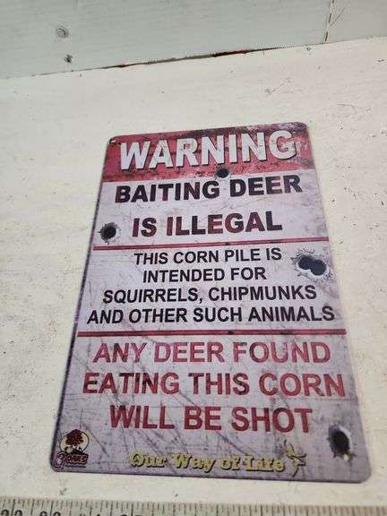 8 X 12 IN. METAL SIGN- BAITING DEER - Isabell Auction