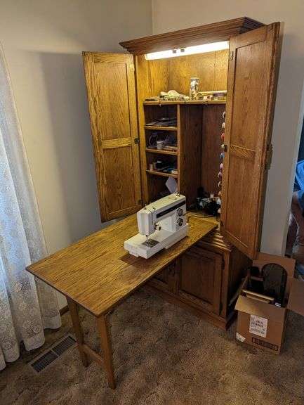 CUSTOM OAK 4-DOOR DROP-DOWN LIGHTED SEWING CABINET WITH MACHINE, SPOOLS ...