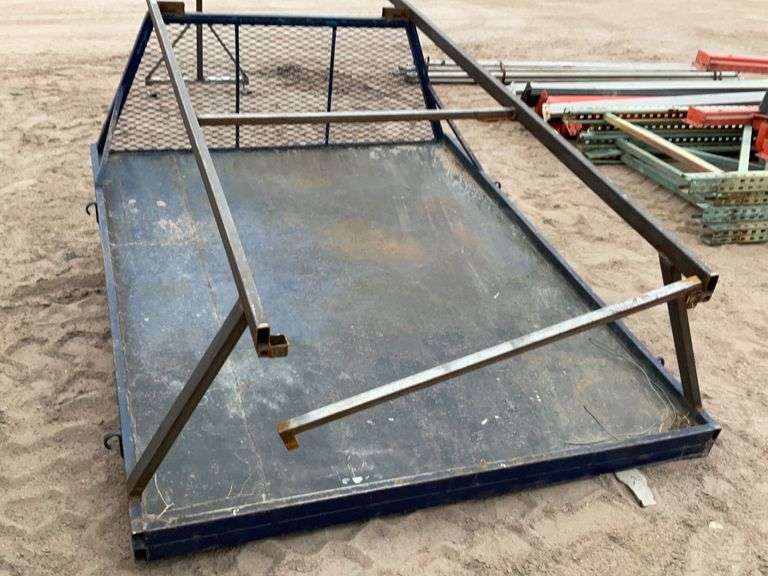 Flat bed over cab pipe rack - J&J Auctioneers LLC