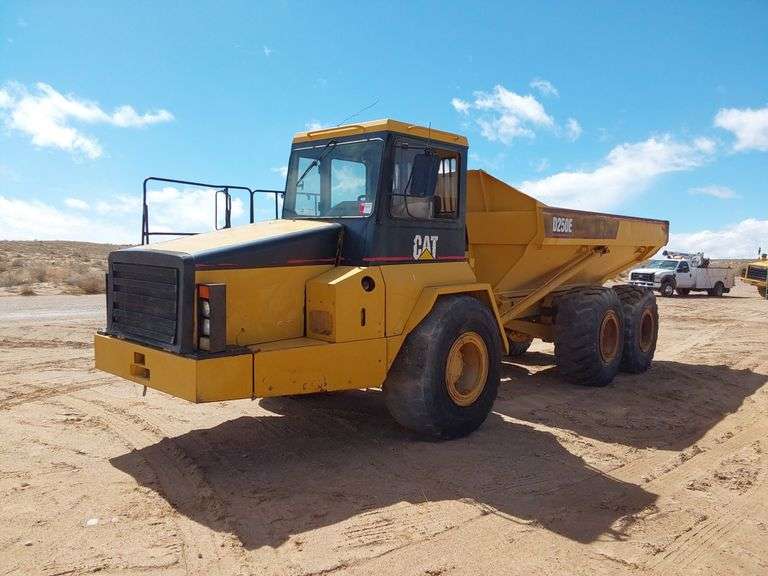 1997 Cat D250E Articulated Dump Truck - J&J Auctioneers LLC